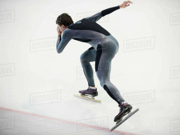Male speed skater skating - Stock Photo - Dissolve