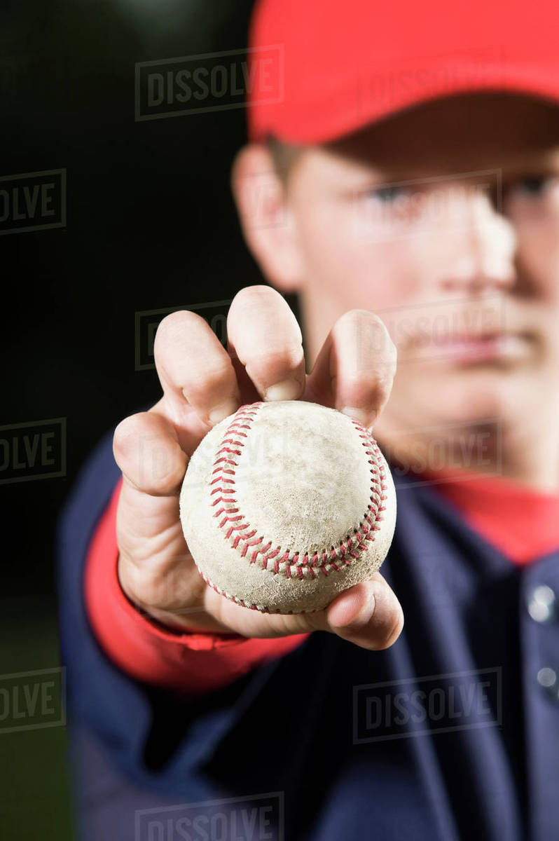 Baseball pitcher holding ball - Royalty-free Stock Photo | Dissolve