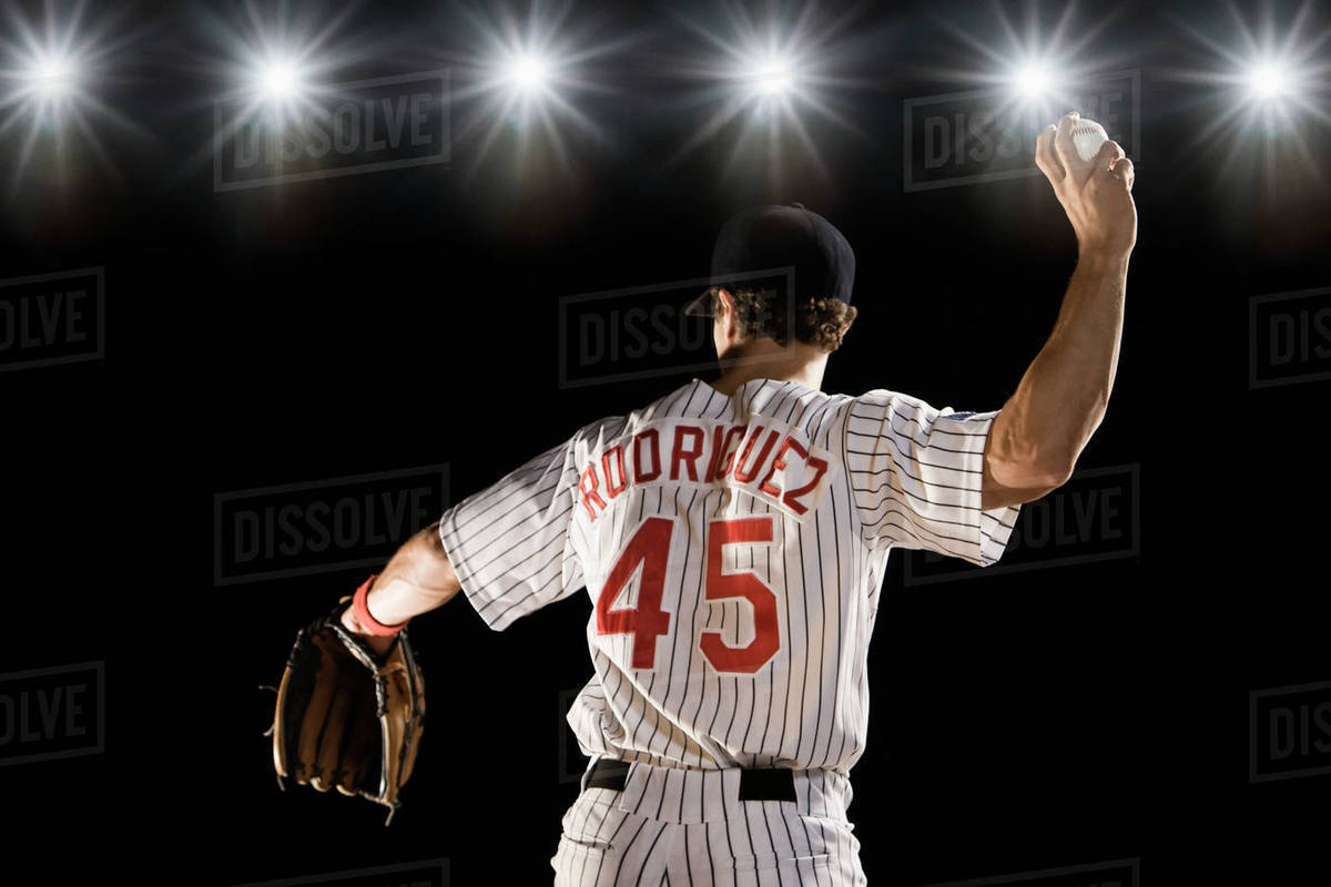 Pitcher throwing baseball - Royalty-free Stock Photo | Dissolve