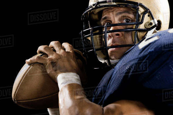 Close up of quarterback preparing to throw football - Royalty-free ...