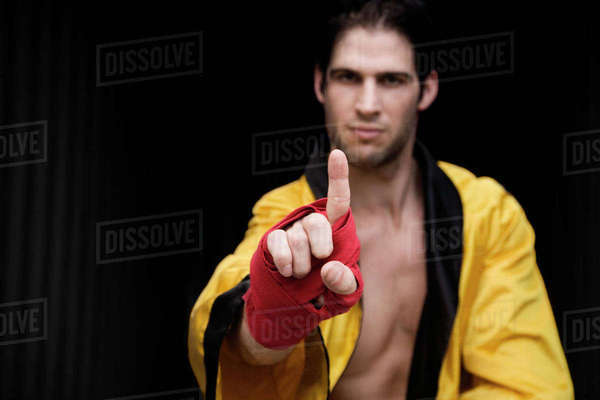 Portrait of boxer with finger extended - Stock Photo - Dissolve