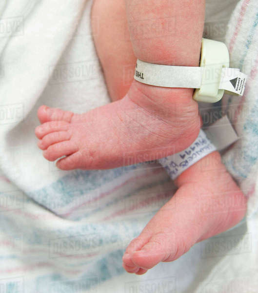 Newborn baby's feet with hospital tags - Royalty-free Stock Photo ...