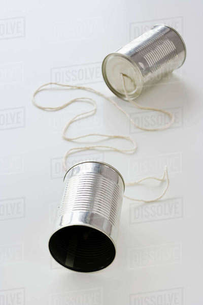 Tin cans connected by string - Royalty-free Stock Photo | Dissolve
