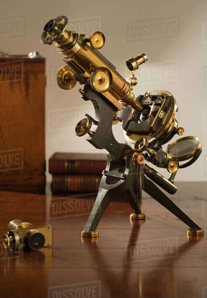 Old fashioned microscope on table - Royalty-free Stock Photo | Dissolve