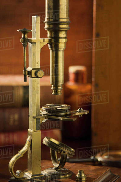 Old fashioned microscope on table - Royalty-free Stock Photo | Dissolve