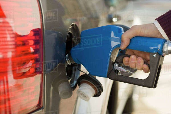 Man pumping gas - Stock Photo - Dissolve