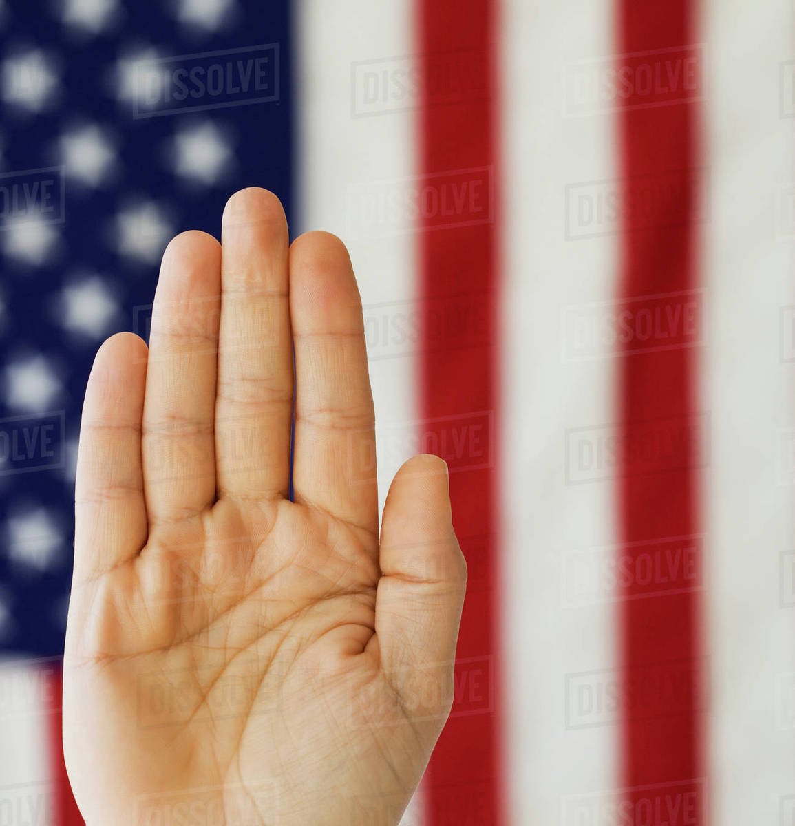 Man’s hand up in front of American flag - Royalty-free Stock Photo ...
