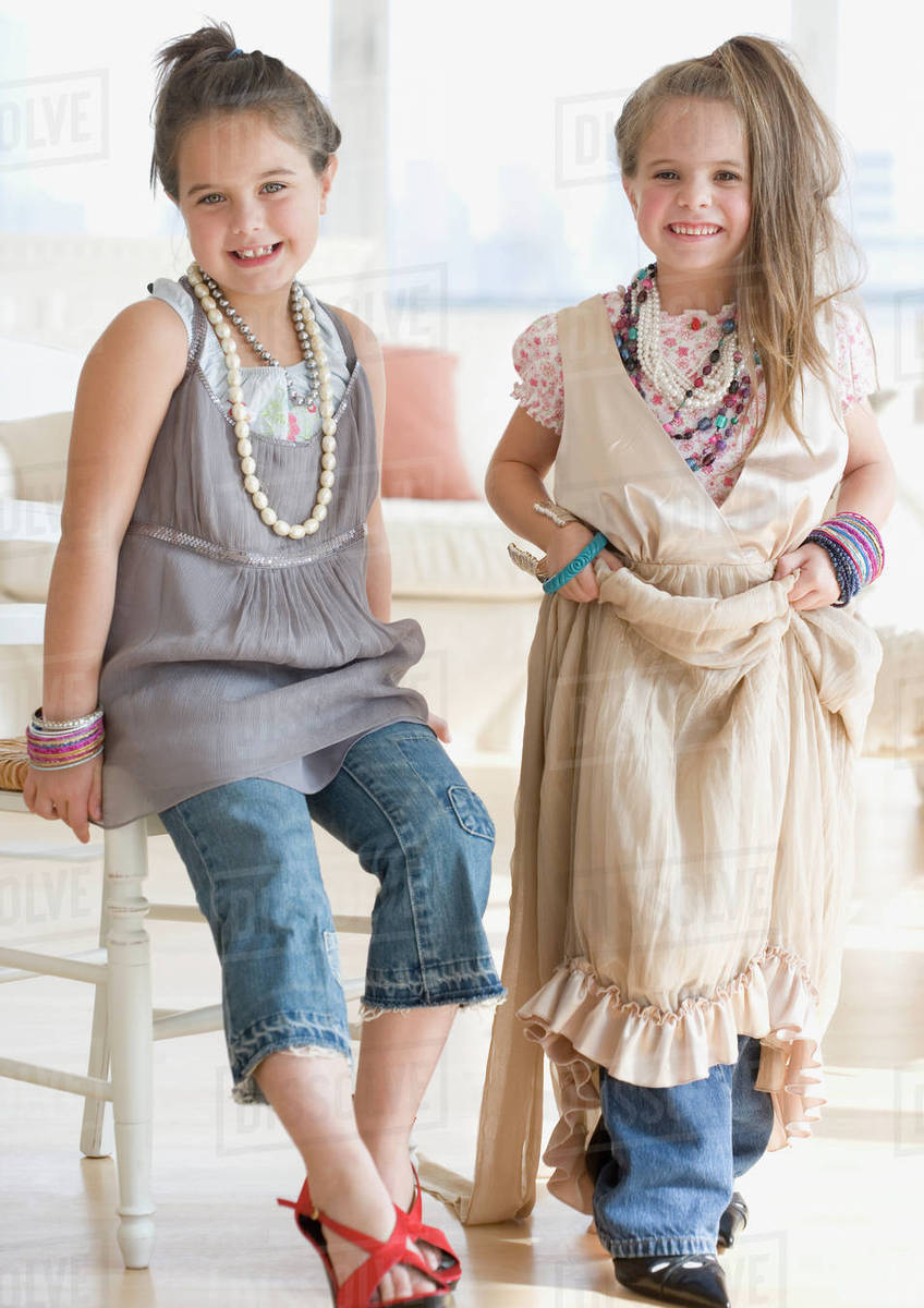 Portrait of sisters playing dress up - Royalty-free Stock Photo | Dissolve