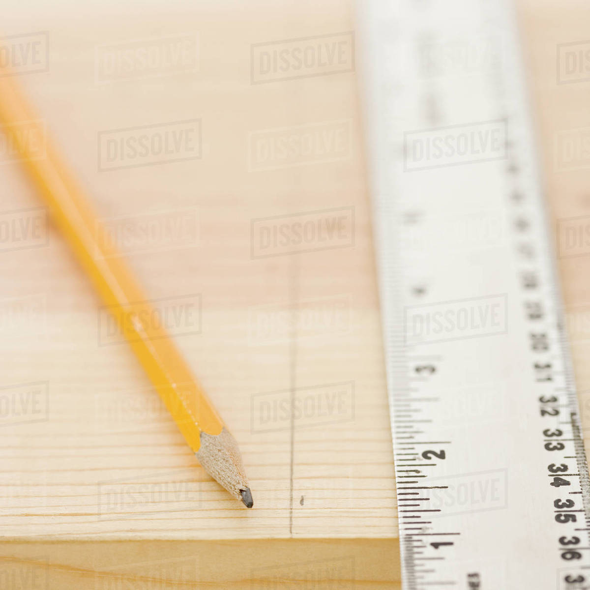 Close up of ruler and pencil on wood - Royalty-free Stock Photo | Dissolve