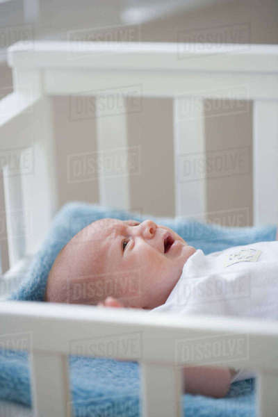 Baby crying in crib - Royalty-free Stock Photo | Dissolve