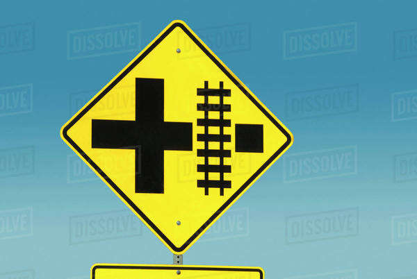 Yellow road sign depicting railroad crossing - Royalty-free Stock Photo ...