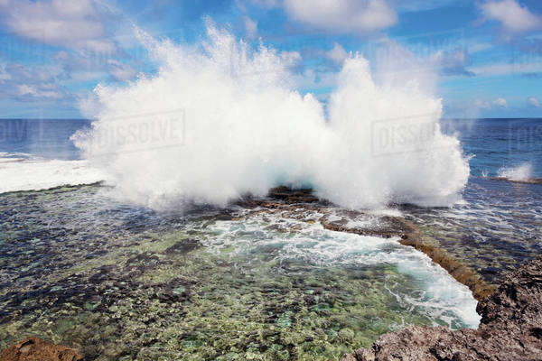 Wave crushing on rock - Royalty-free Stock Photo | Dissolve