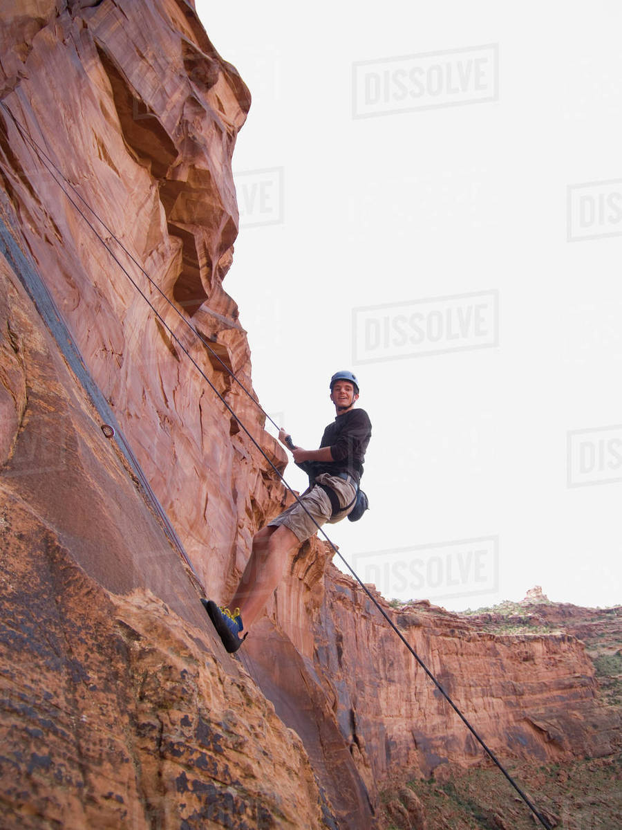 Man rock climbing - Stock Photo - Dissolve