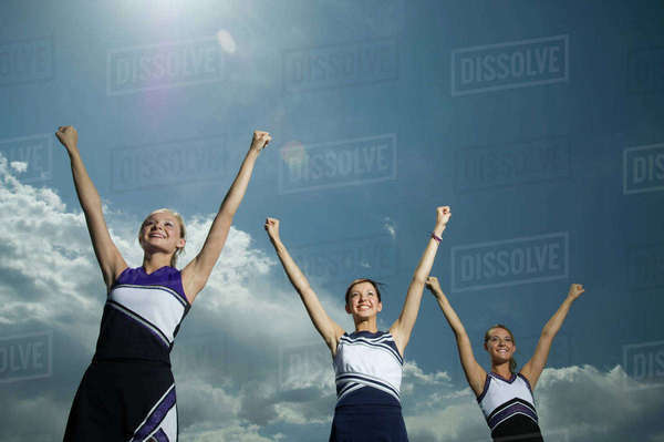 Cheerleaders with arms raised - Royalty-free Stock Photo | Dissolve
