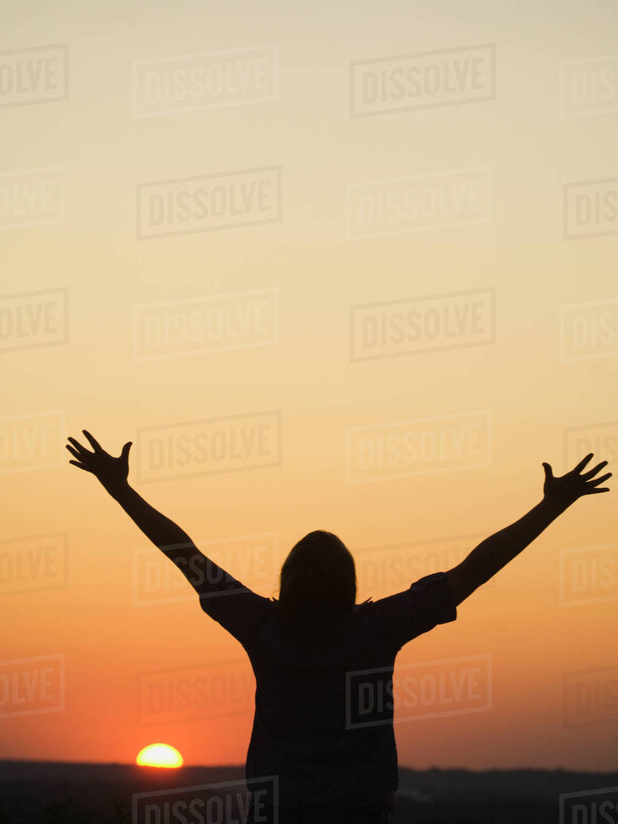 Person with arms raised - Royalty-free Stock Photo | Dissolve