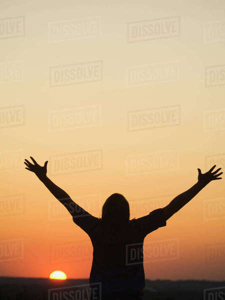 Person with arms raised - Royalty-free Stock Photo | Dissolve