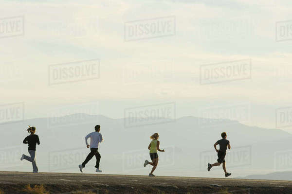 Group of people running on road, Utah, United States - Stock Photo ...