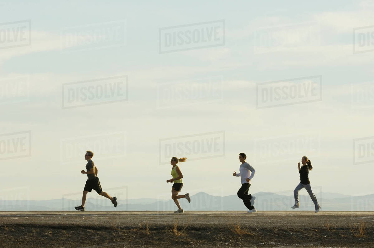 Group of people running on road, Utah, United States - Stock Photo ...