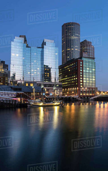 Skyscrapers reflecting on water surface at dawn - Royalty-free Stock ...