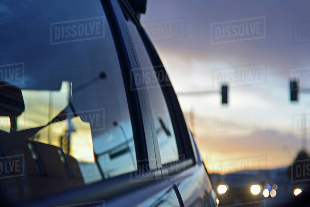 Reflections of city traffic in car's window - Stock Photo - Dissolve