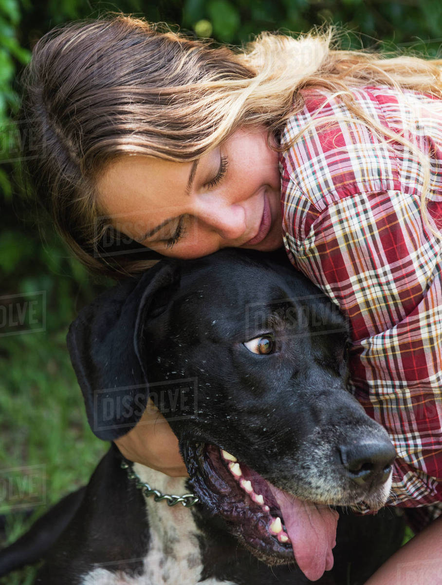 Woman hugging Great Dane - Royalty-free Stock Photo | Dissolve