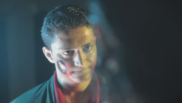 Shot of a person with bleeding on his face looking terrifying look to ...