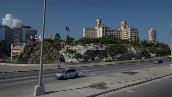 Establishing drone aerial shot of iconic cuba sign and hotel on malecon ...
