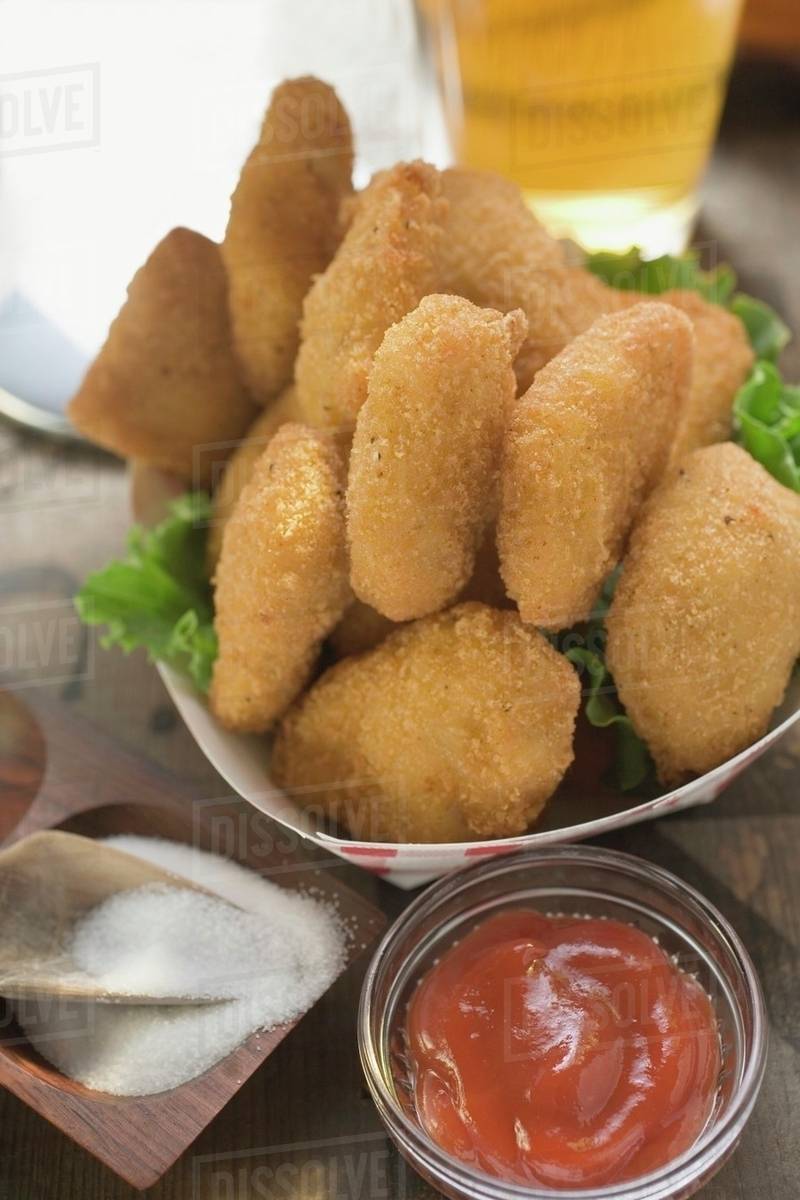 Chicken Nuggets in cardboard dish, ketchup, salt - Royalty-free Stock ...