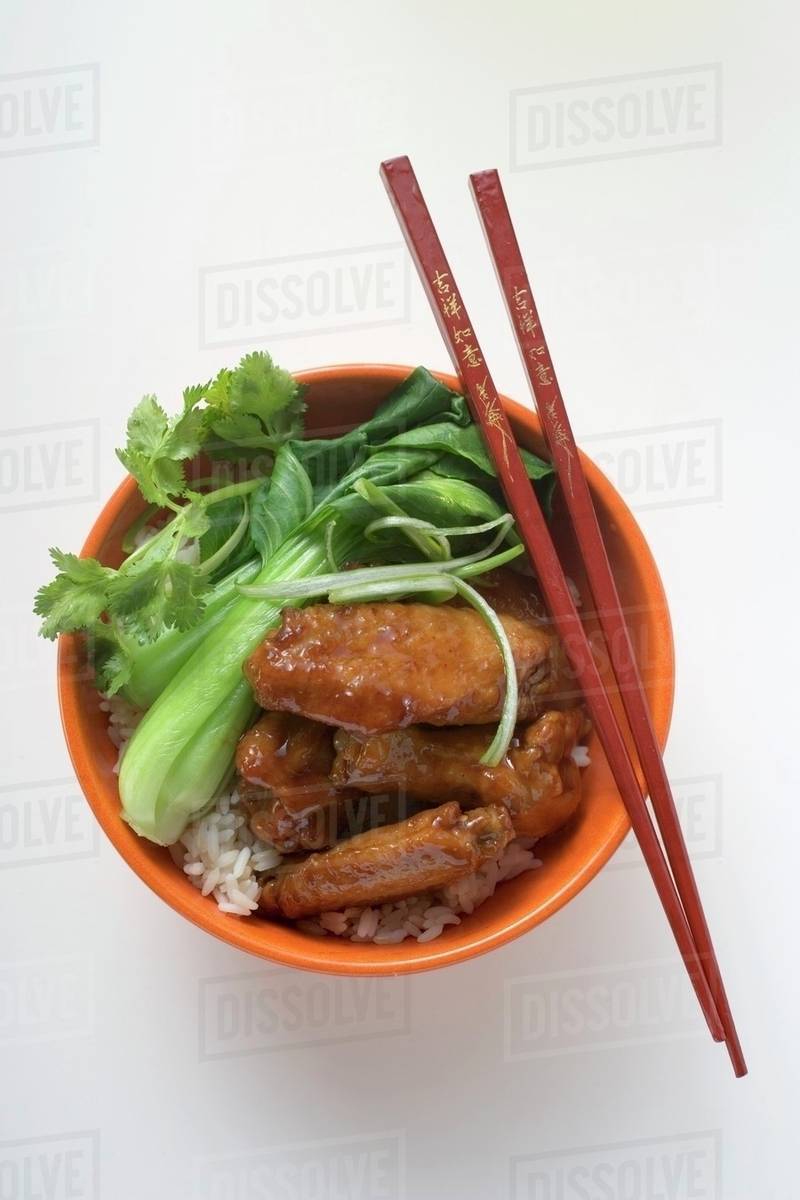 Chicken wings with rice and pak choi (Asia) - Stock Photo - Dissolve