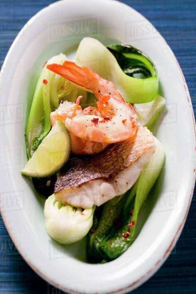 Shrimps and fish with pak choi - Royalty-free Stock Photo | Dissolve