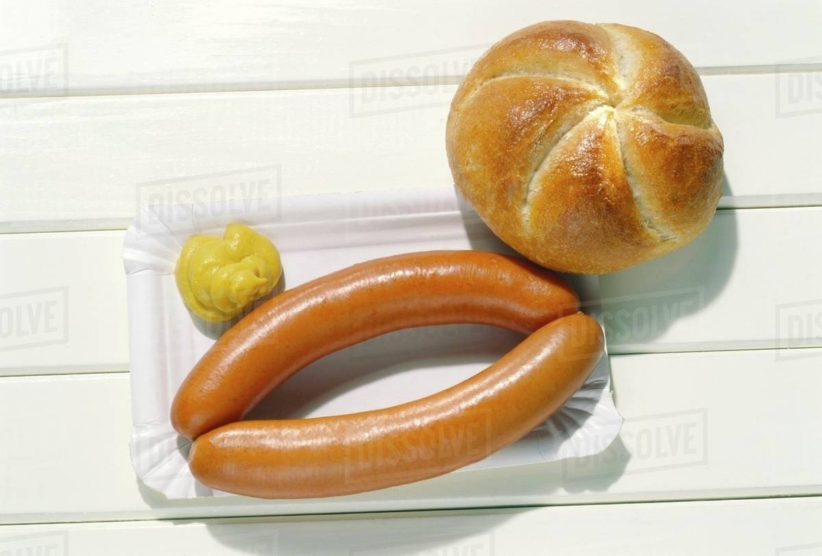 Two Wieners on a Paper Plate with a Dollop of Mustard; Roll - Stock ...