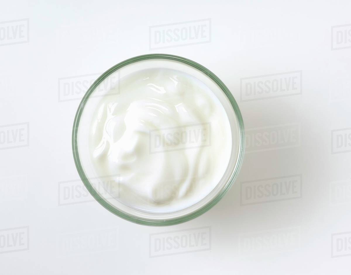 Natural yogurt in a glass bowl, seen from above - Royalty-free Stock ...