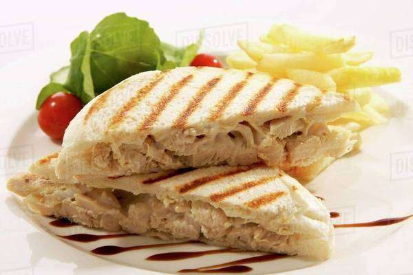 Toasted chicken sandwich with chips - Royalty-free Stock Photo | Dissolve