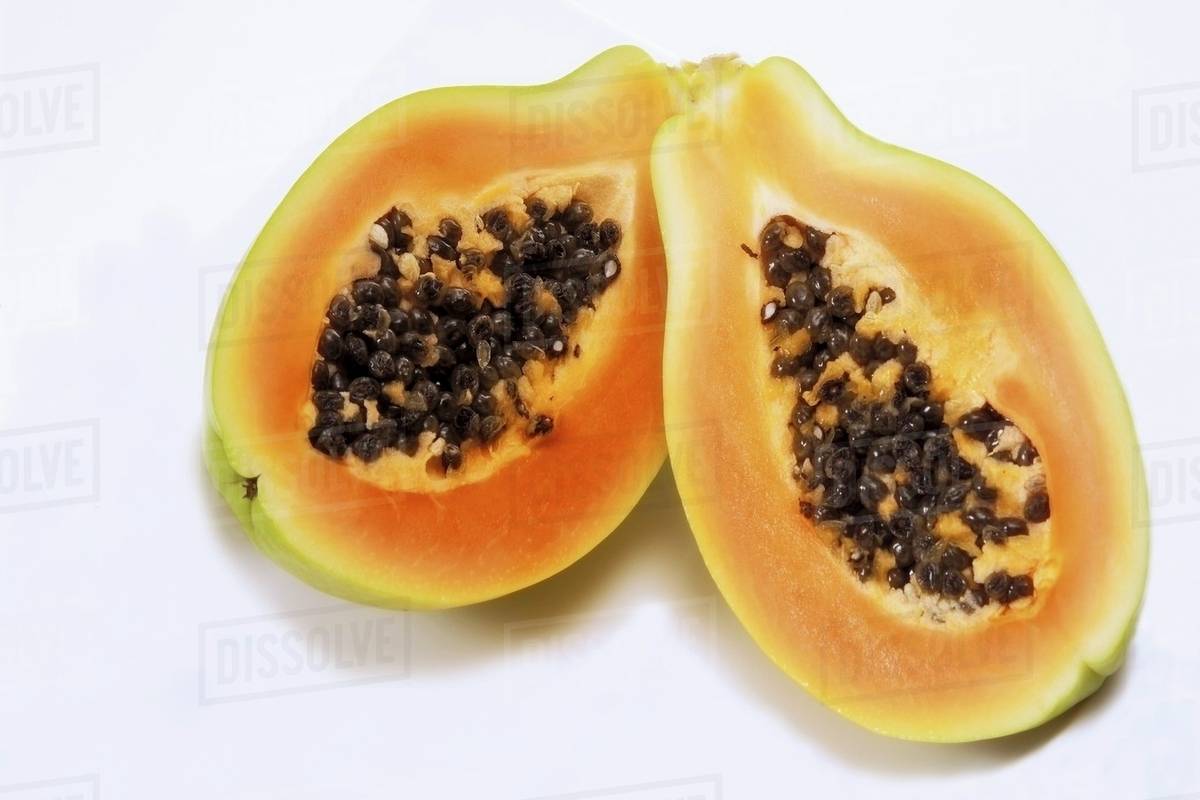 Halved papaya - Stock Photo - Dissolve