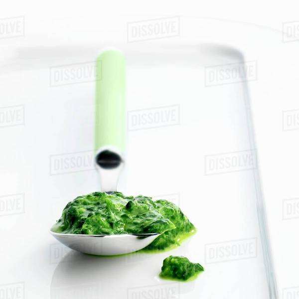 Spinach on a spoon - Stock Photo - Dissolve
