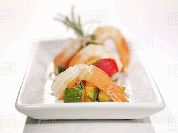 Prawn tails on ratatouille - Stock Photo - Dissolve