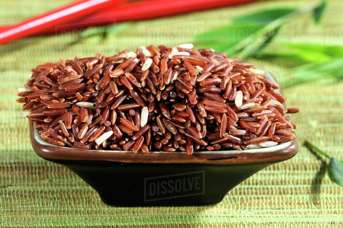 Whole grain red rice in dish - Royalty-free Stock Photo | Dissolve