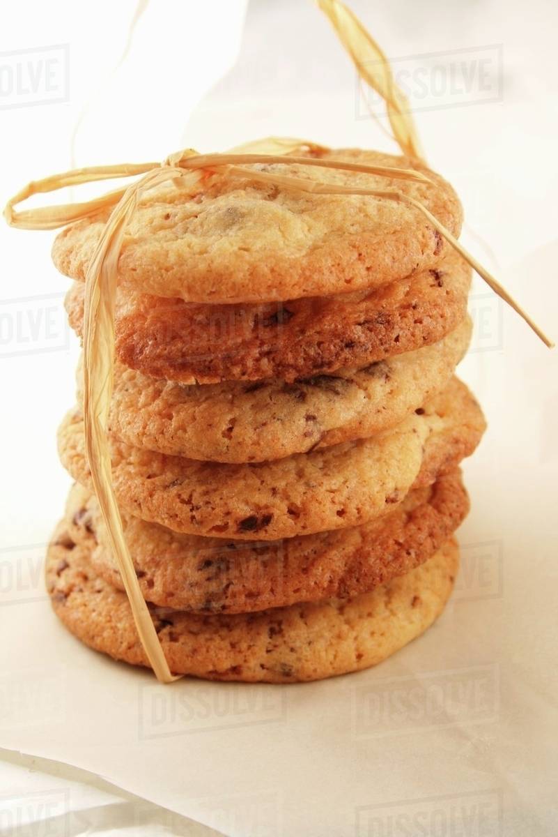 Cookies, stacked and tied with string - Stock Photo - Dissolve