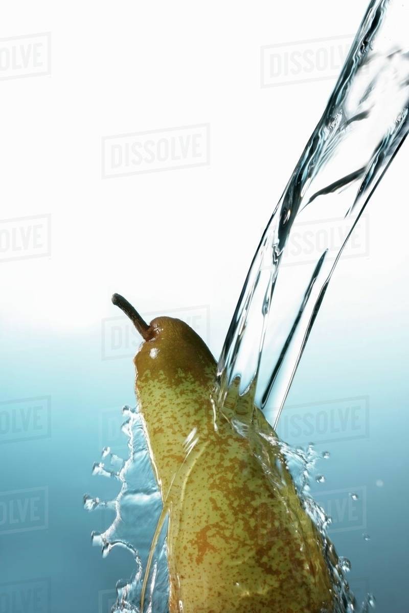 Washing a pear - Royalty-free Stock Photo | Dissolve