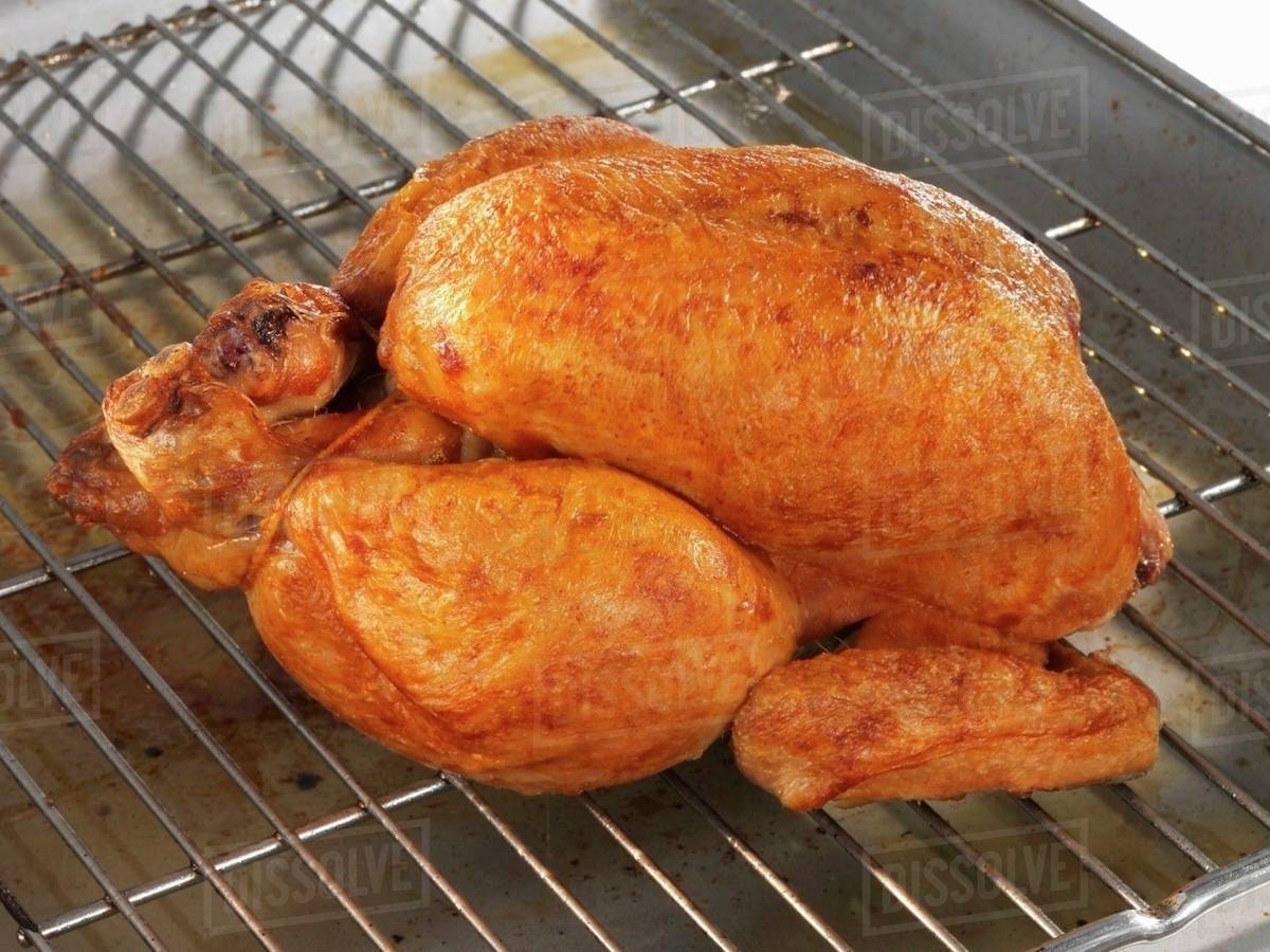 Whole roast chicken on rack - Royalty-free Stock Photo | Dissolve