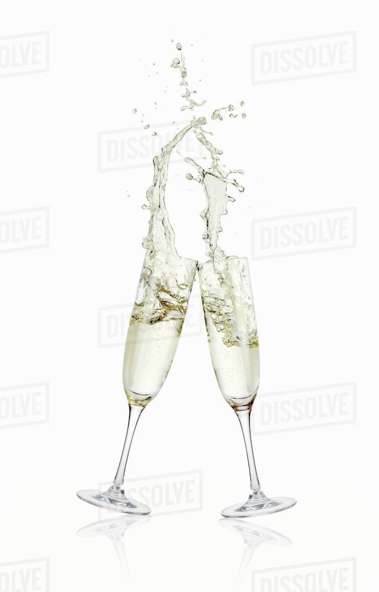 Glasses of sparkling wine clinking together - Royalty-free Stock Photo ...
