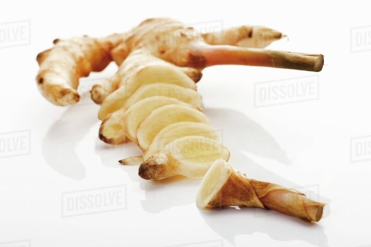 Hawaiian ginger root, partly sliced - Royalty-free Stock Photo | Dissolve