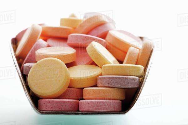 Coloured glucose tablets in scoop - Royalty-free Stock Photo | Dissolve