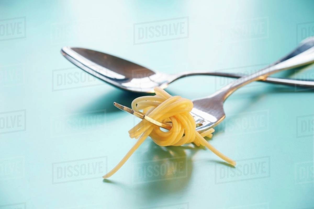 Spoon and fork with spaghetti - Royalty-free Stock Photo | Dissolve
