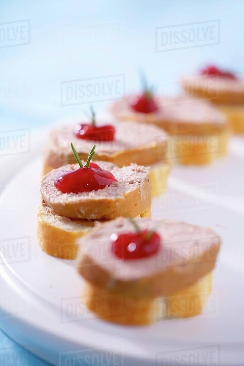 Canapes: pate, cranberry jelly & rosemary on baguette slices - Royalty ...