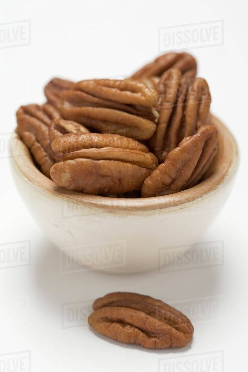 Pecans in small bowl - Royalty-free Stock Photo | Dissolve