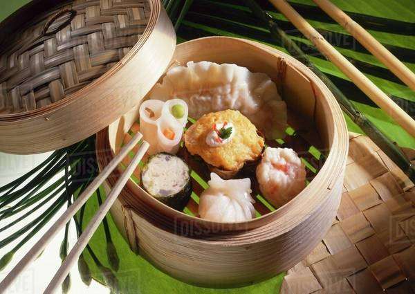 Assorted dim sum in a steaming basket - Royalty-free Stock Photo | Dissolve