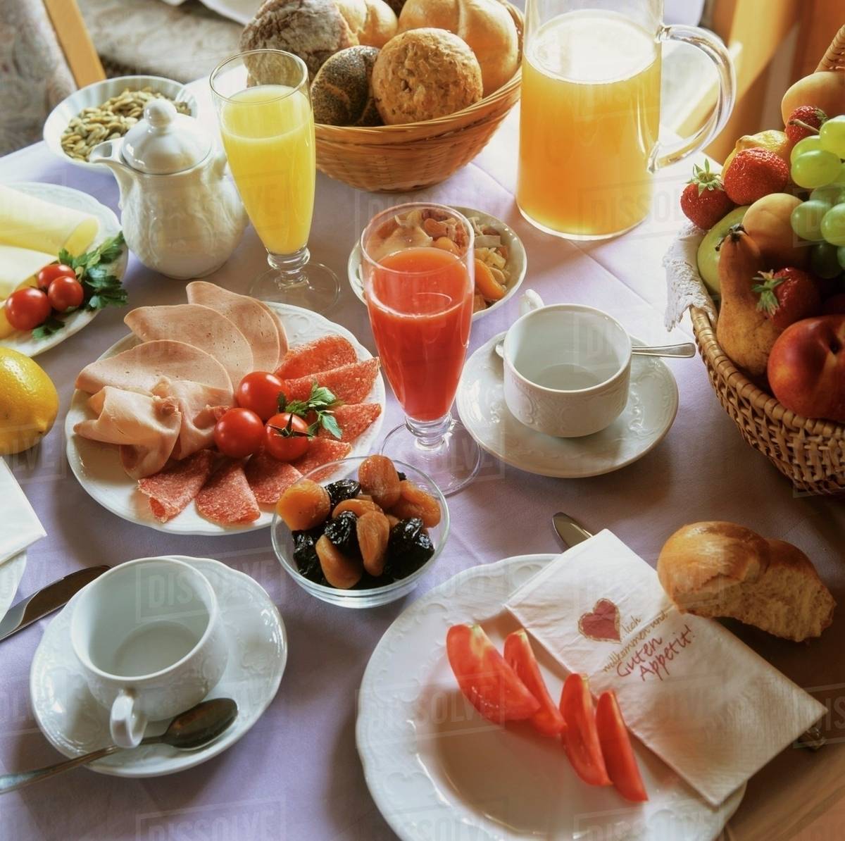 Breakfast table with juices, cold cuts and fruit - Royalty-free Stock ...