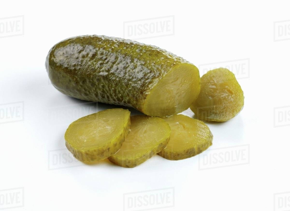 Gherkin, partly sliced - Stock Photo - Dissolve