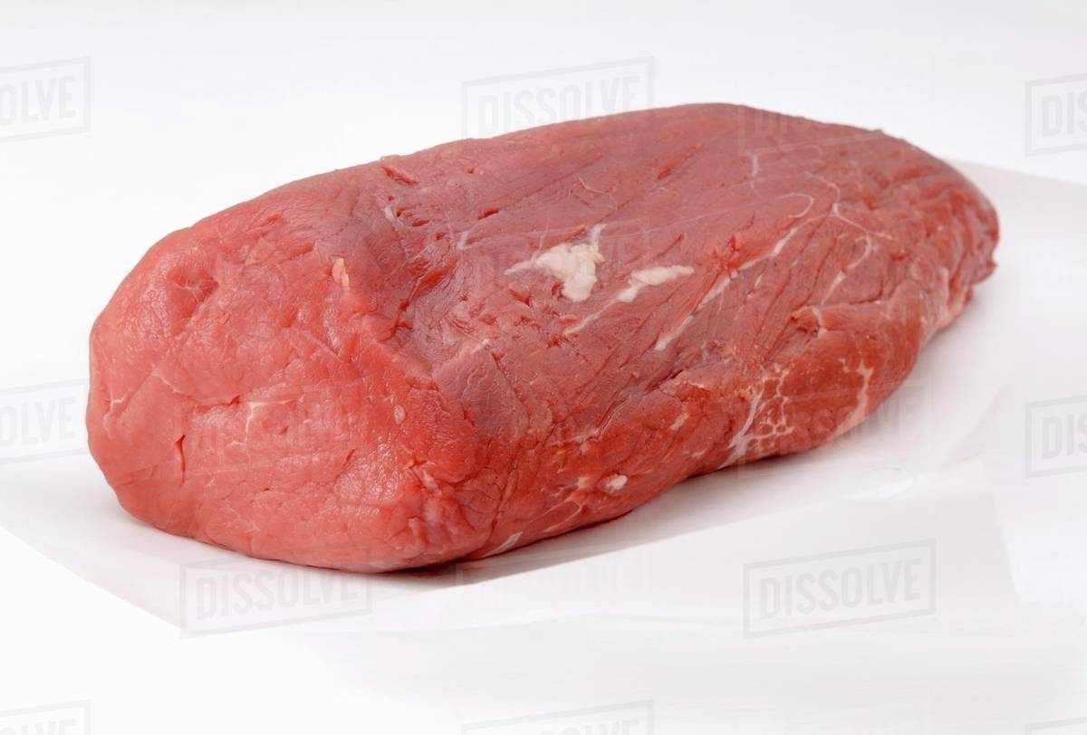 Fresh beef fillet on paper - Stock Photo - Dissolve